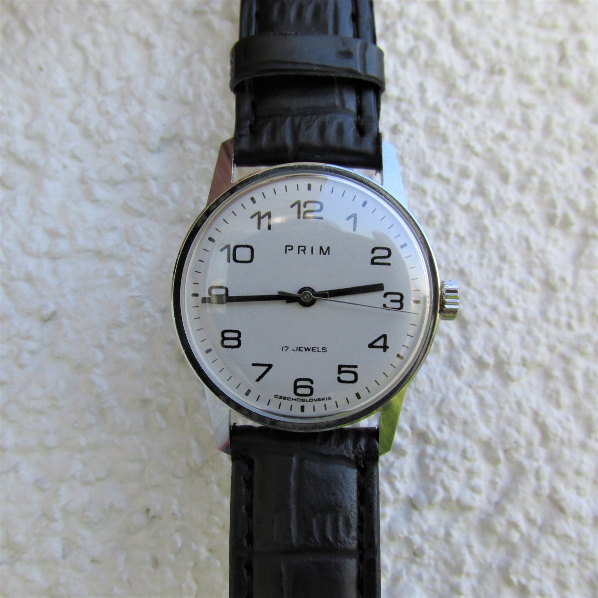 Hodinky Prim, nové, chromované, z roku 1973 – Potvor - pomáhat tvořit